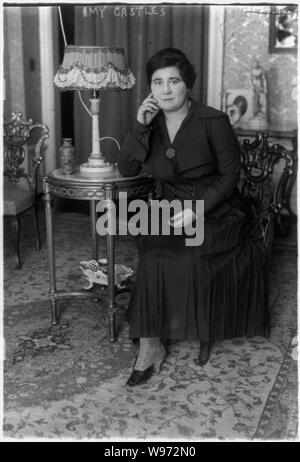 Amy Castles, full length portrait, seated, facing front. Australian ...