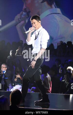Taiwanese singer and actor Stanley Huang performs during the opening ...