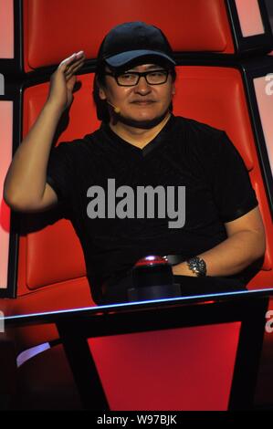 Chinese vocalist Liu Huan attends a talent show, The Voice China, first ...