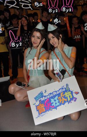 Yumi Bai Wei-Ling, left, and Miko Bai Wei-Fen of Singaporean pop twins ...