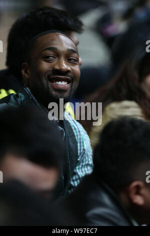 Gilbert Arenas of the Shanghai Sharks looks on in the 22th round match ...