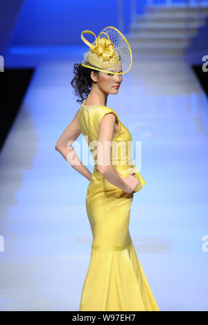 Chinese model Mo Wandan displays a new creation by Hong Kong designer ...