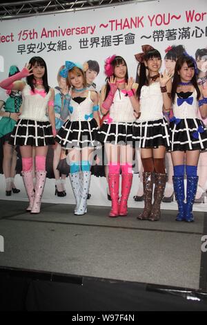 Members of Japanese pop idol girl group Morning Musume wave at a ...