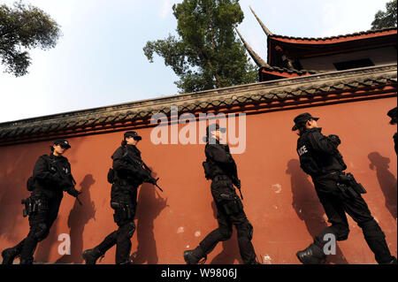 Chinese special policewomen patrol a street in Chengdu city, southwest ...