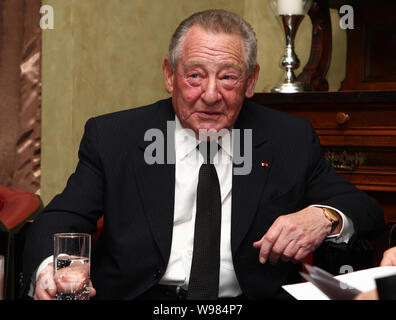 Accor co-founder Gerard Pelisson (C) is pictured during the 1st ...