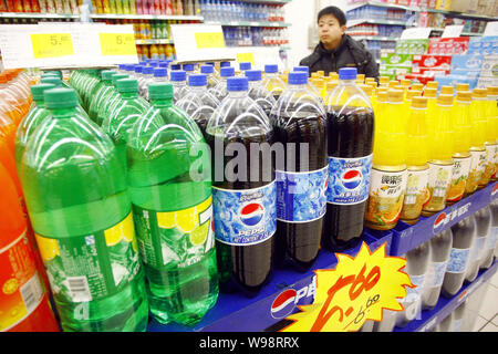 A Chinese customer shops for beverages of PepsiCo at a supermarket in ...