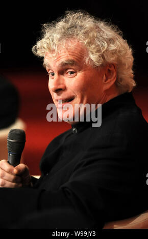 Sir Simon Rattle (R), principal conductor of Berlin Philharmonics, and ...
