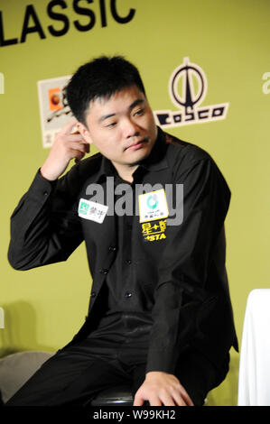 Chinese professional snooker player Ding Junhui plays a shot at the ...