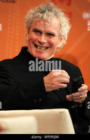 Sir Simon Rattle (R), principal conductor of Berlin Philharmonics, and ...