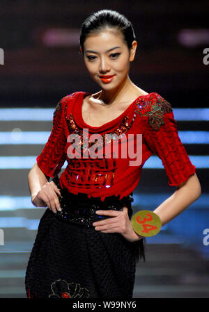 A model wearing garment with Chinese elements pose on the stage during ...