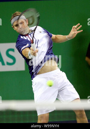 Mardy Fish returns a shot during the 2003 NASDAQ-100 Open Tennis ...