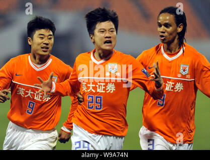 Li Jinyu, left, of Chinas Shandong Luneng FC celebrates with his ...