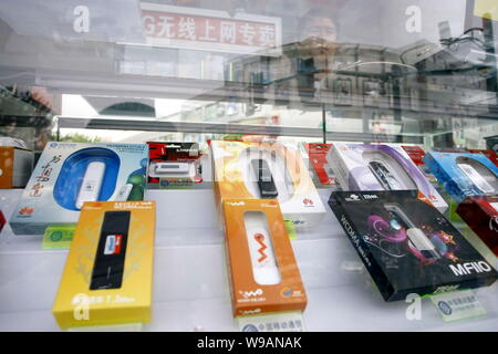 Wireless modems are for sale at a telecommunication products mall in ...