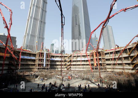 Chinese construction workers concrete the foundation of the Shanghai ...