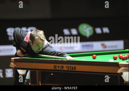 Allister Carter of England plays a shot to Adam Stefanow of Poland at ...