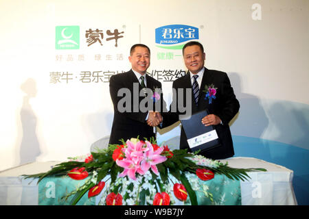 Yang Wenjun, left, President of Mengniu Group, and Wei Lihua, Chairman ...