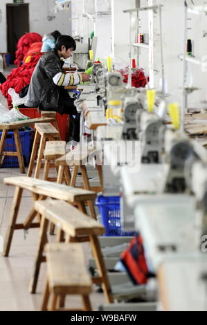 Garment workers work at a factory after garment factories reopened ...
