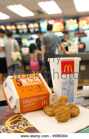 McDonald's chicken mcnuggets in box packaging with lid open on white ...