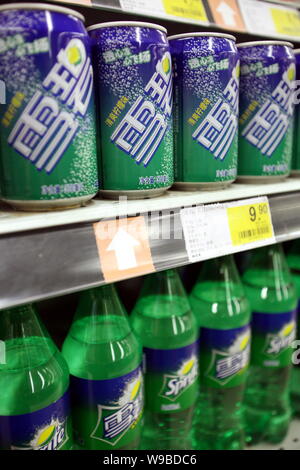 Bottles of Sprite soft drinks are seen displayed in a supermarket store ...