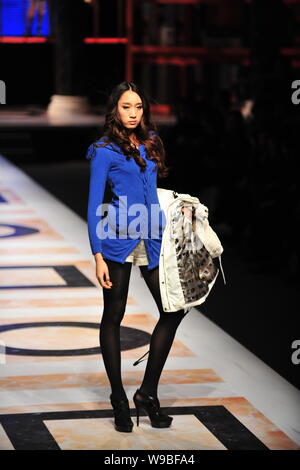 A model parades to show new creations at the WSM fashion show during ...