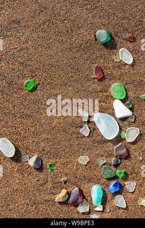 Glass pebble on sand Stock Photo - Alamy