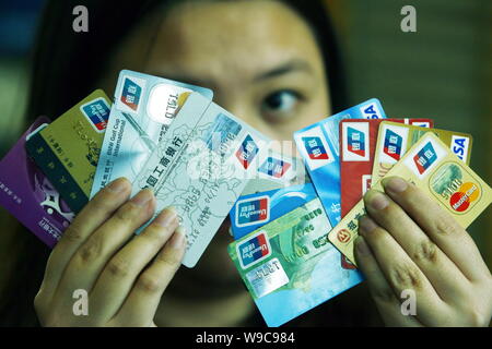 --FILE--Logos of China UnionPay, Visa and MasterCard are pictured at a ...
