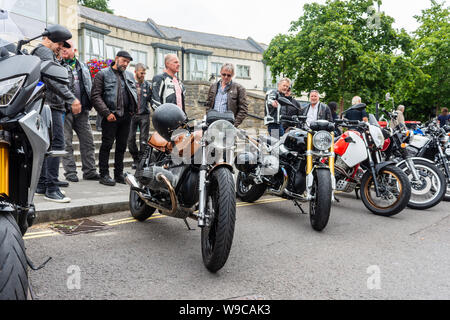 Motorcycles at the annual Calne bike meet July 2025 with a mural of ...