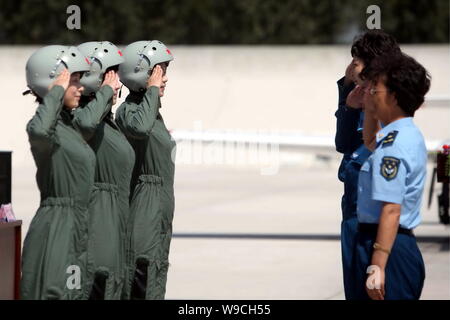 Young female fighter plane pilots of Chinese PLA Air Force walk past ...