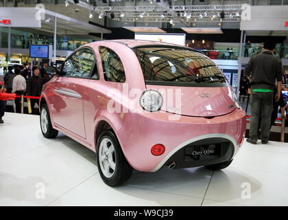 Visitors look at a Chery QQme at the 13th Shanghai International ...