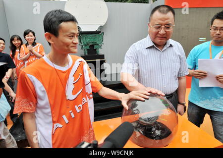 Jack Ma or Ma Yun, front second left, Chairman of Alibaba Group, talks ...