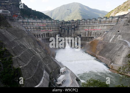 Water is seen discharged from the dam of the Xiaowan Hydropower Station ...