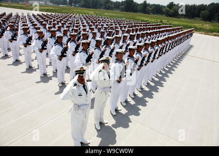 Chinese PLA Navy soldiers parade during a ceremony celebrating the 50th ...