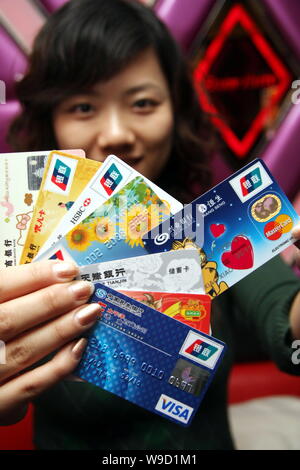 --FILE--Logos of China UnionPay, Visa and MasterCard are pictured at a ...
