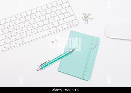Desk with keyboard and mouse, calendar 2020 and a pen Stock Photo - Alamy