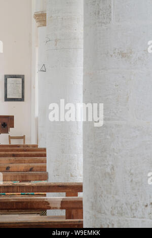 United Kingdom, Norfolk, Shadow of wooden chair cast in warm light on ...