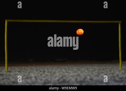 fire moon on soccer goal Stock Photo - Alamy