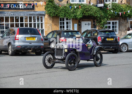 Man driving a 1926 Austin Seven car in Stow on the Wold, Cotswolds ...