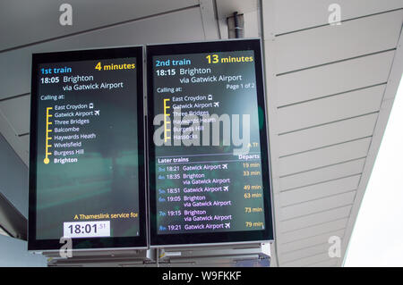National Rail notice board of train times (timetable) on display at ...