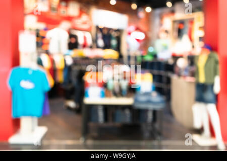 clothing boutique store interior blurred background Stock Photo - Alamy