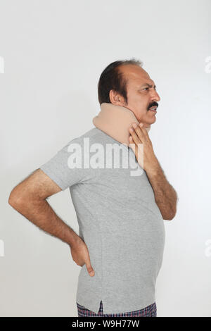 Old man with neck brace Stock Photo - Alamy