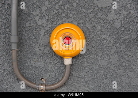 Push button switch, fire alarm on grey wall for alarm and security ...