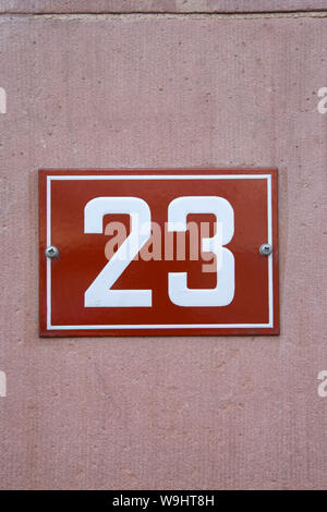 Red Number Twenty-Three on Stone Wall Stock Photo - Alamy