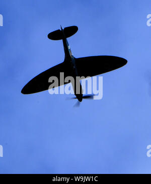 The image shows a Supermarine Spitfire Mk IX performing a display ...