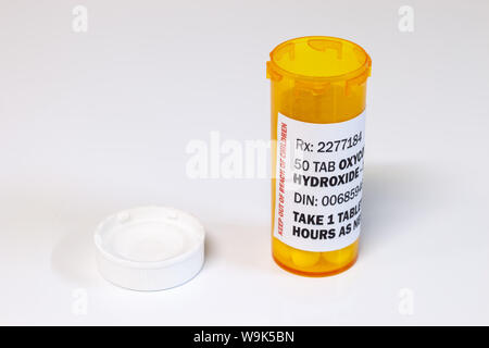 Prescription bottle with Oxycodone tablets isolated on a white ...