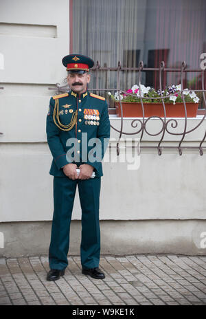 RUSSIA, KAZAN 09-08-2019: A wind instrument parade - a woman in green ...