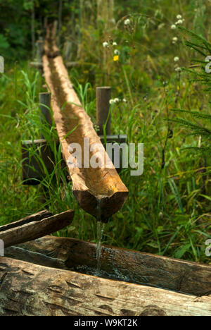 primitive water supply system from wooden gutters leading from the ...