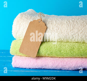 Green paper towels pile on a white background. Pack of paper napkins ...