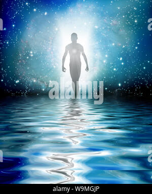 Human Figure Emerges from Light Stock Photo - Alamy