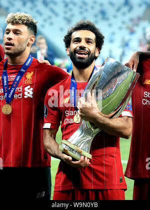 Liverpool's Mohamed Salah celebrates with the trophy after winning the ...