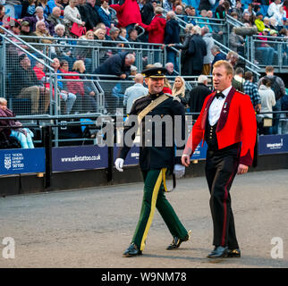 People in military uniforms walk along Red Square in Moscow. Victory ...